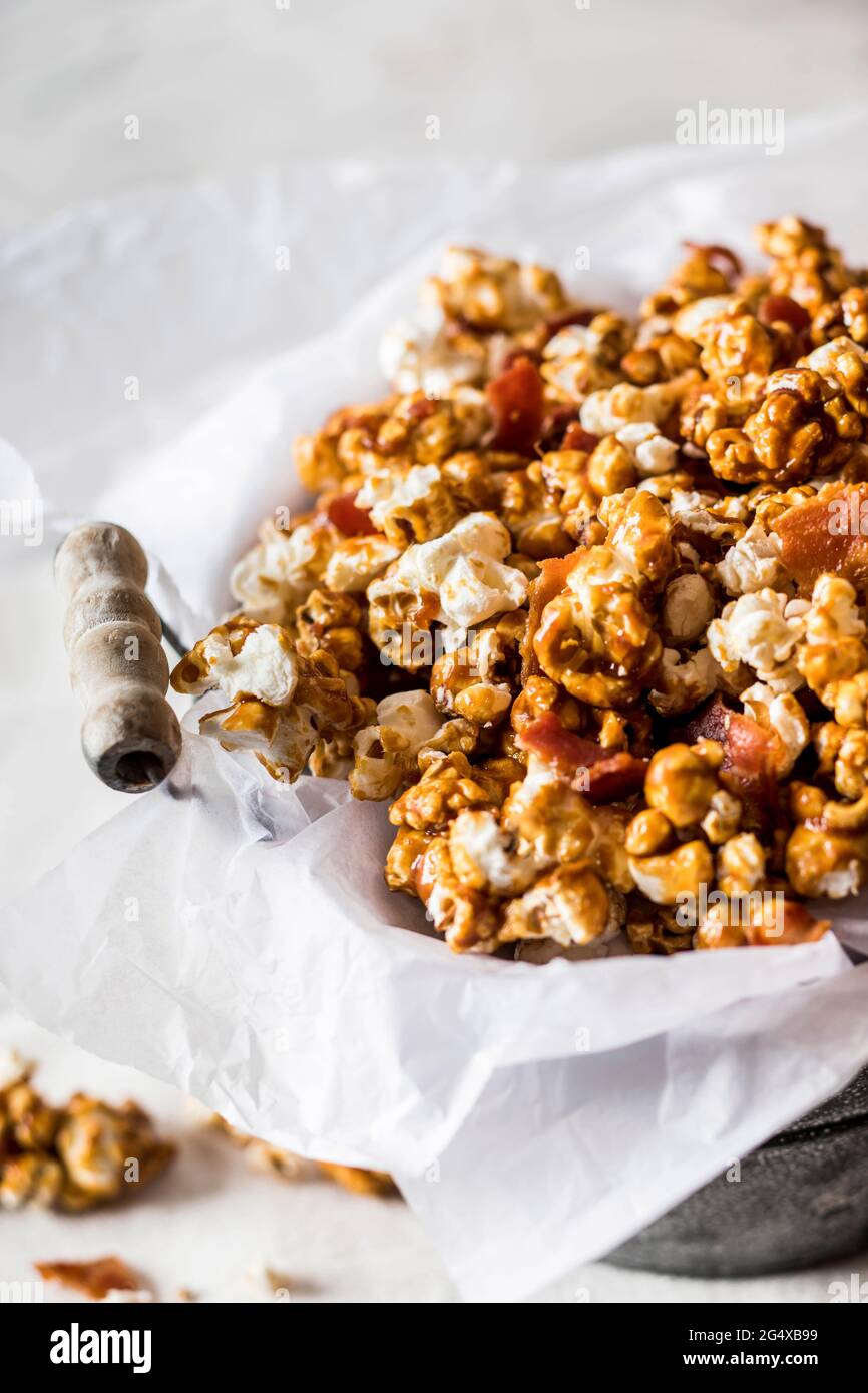 Bucket of caramel corn with bacon Stock Photo - Alamy
