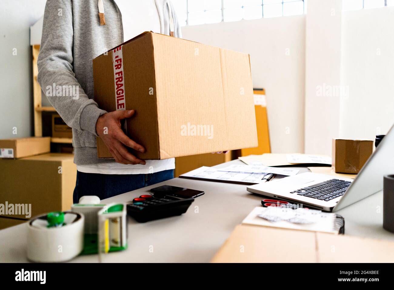 Box carrying man midsection hi-res stock photography and images - Alamy