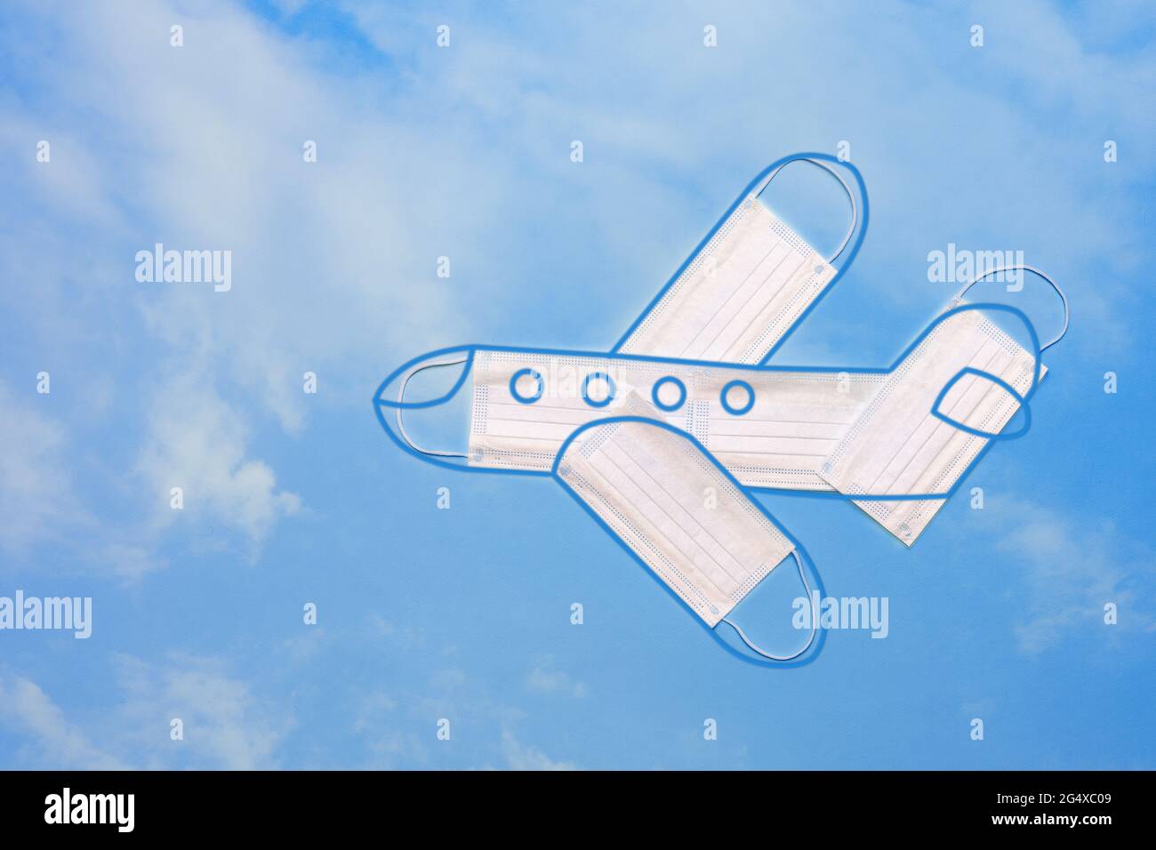 Airplane model made of protective masks with the outline of the ...