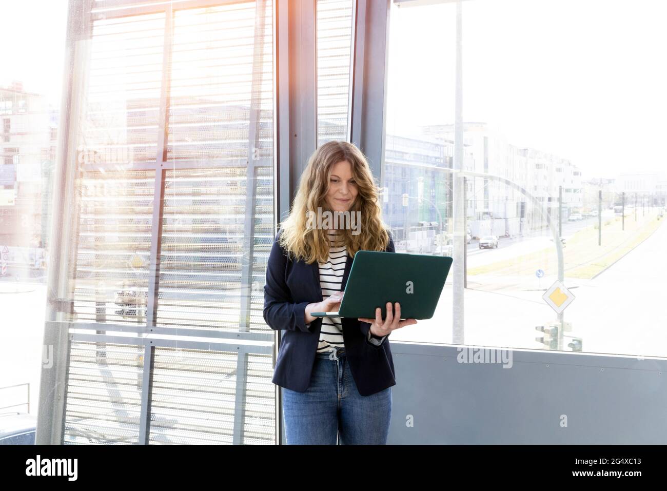 Female in window hi-res stock photography and images - Alamy