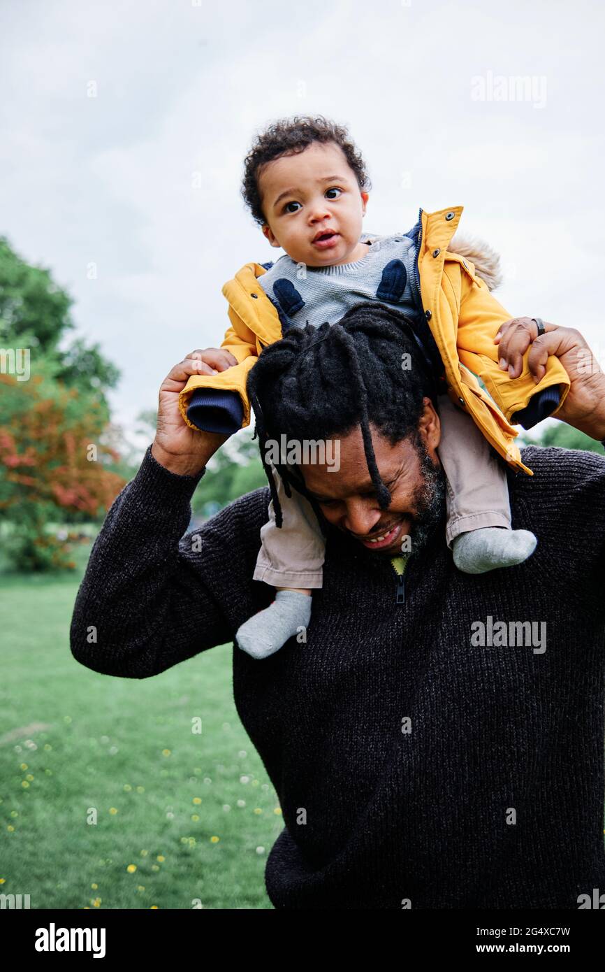 Father carrying son on shoulder hi-res stock photography and images - Alamy