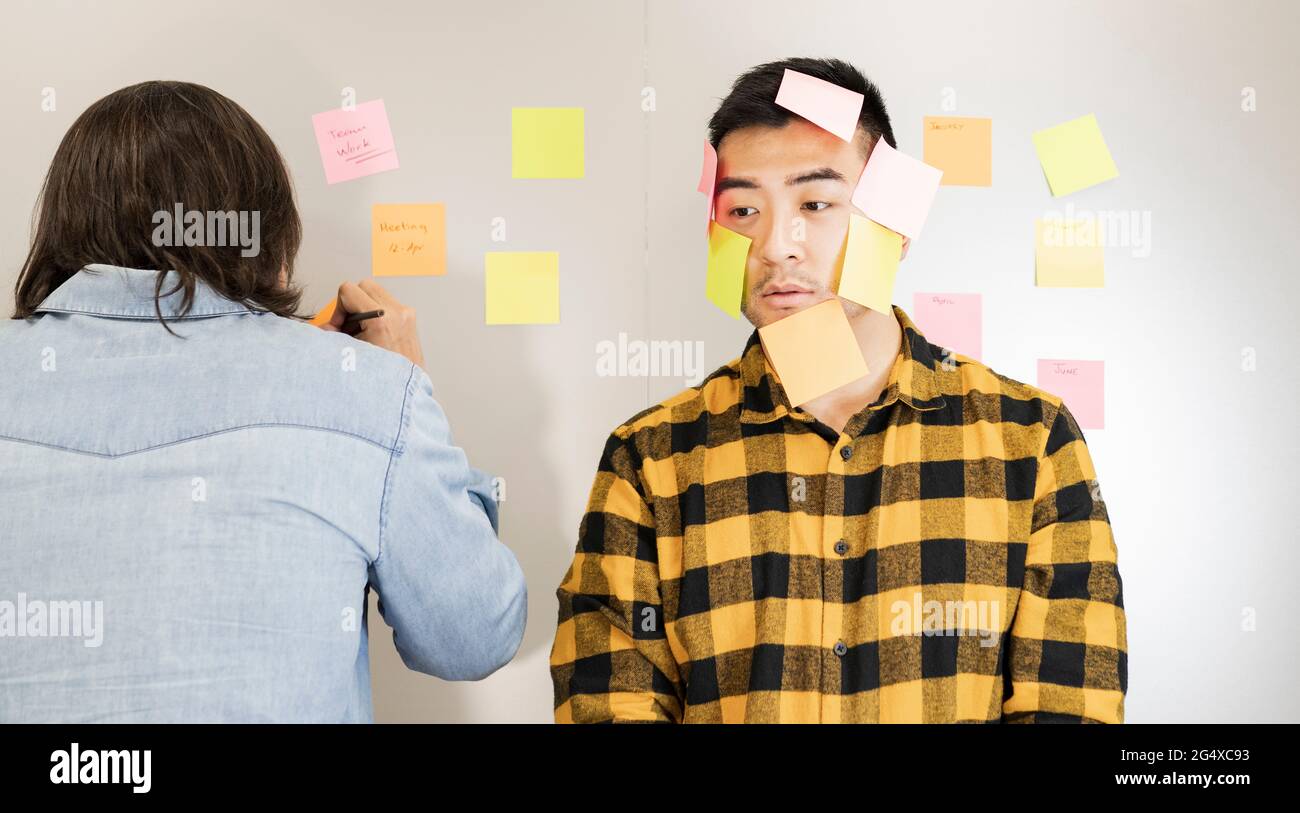 Confused young man standing in hi-res stock photography and images - Alamy