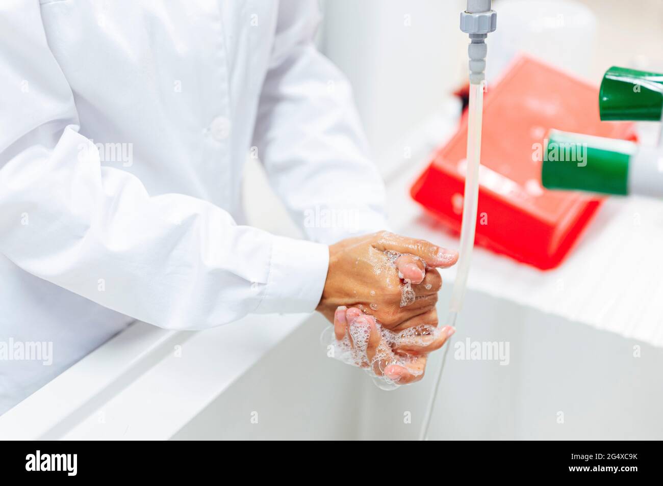 Scientists washing hands in sink hi-res stock photography and images ...