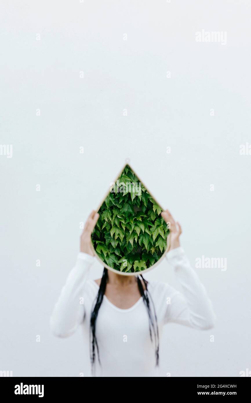 Woman mirror reflection covering face hi-res stock photography and ...
