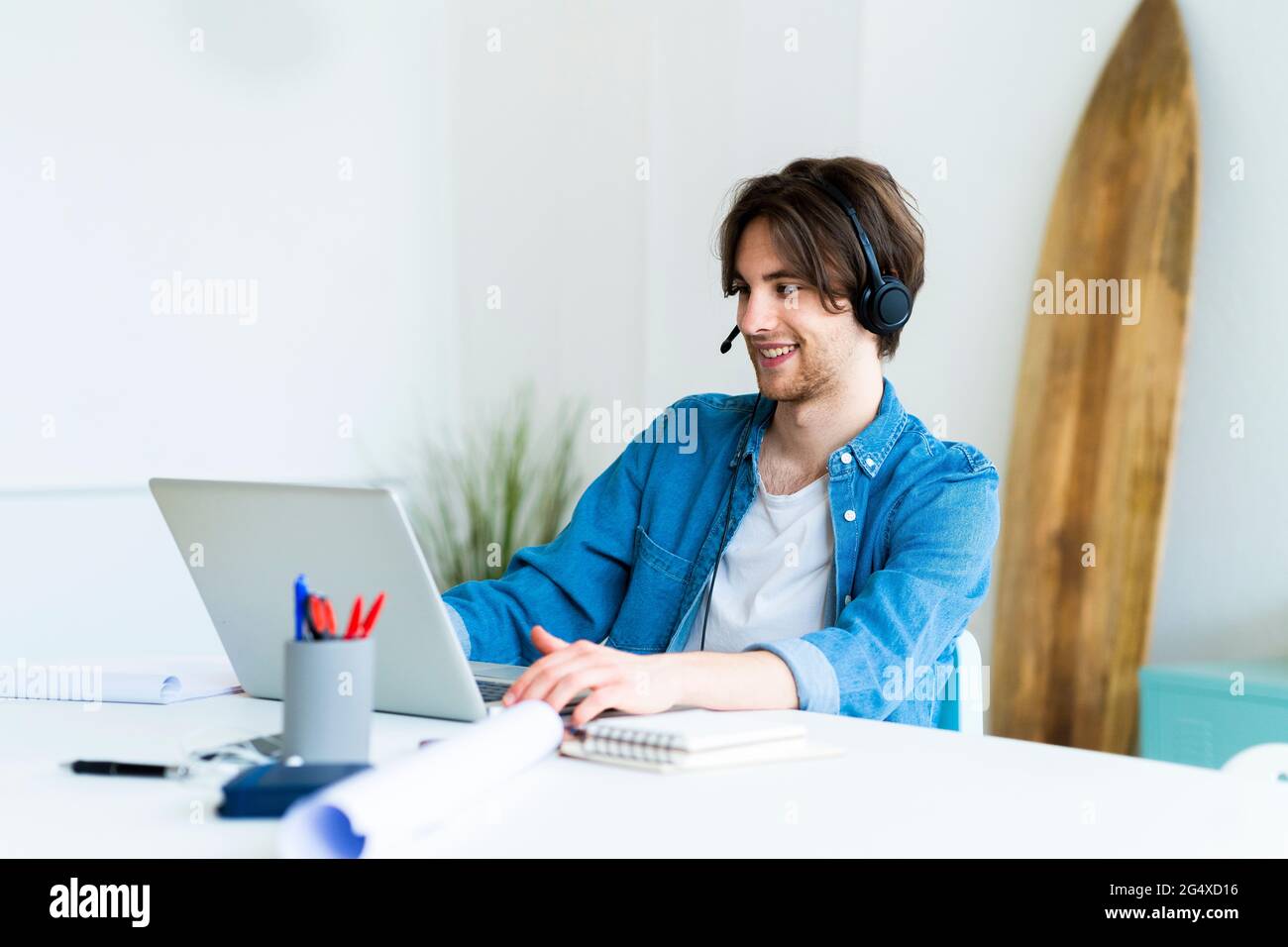 Businessman using headset while working hi-res stock photography and ...