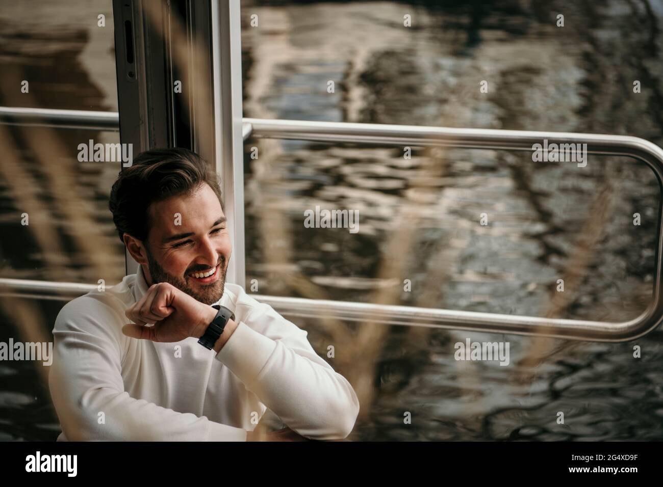 Man leaning on railing taking hi-res stock photography and images - Alamy