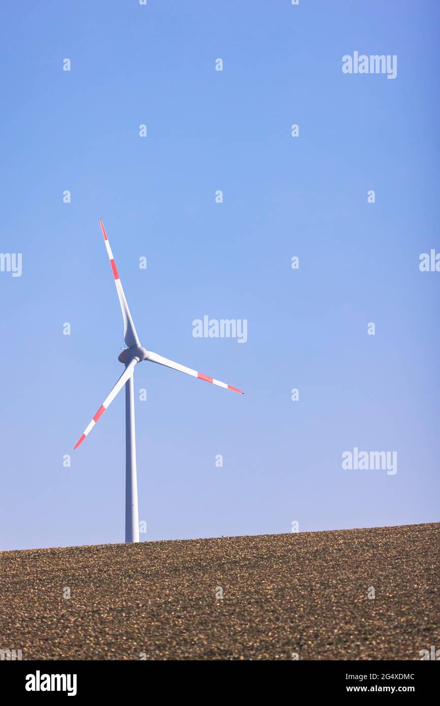 Modern wind turbine against blue hi-res stock photography and images ...