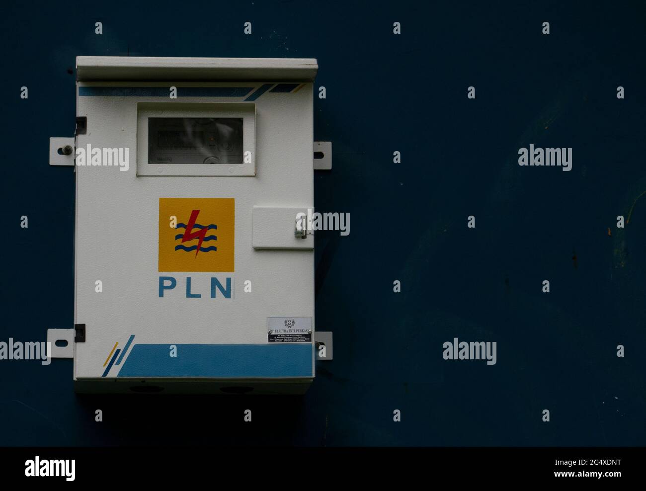 KWH meter box attached to the blue wall Stock Photo - Alamy