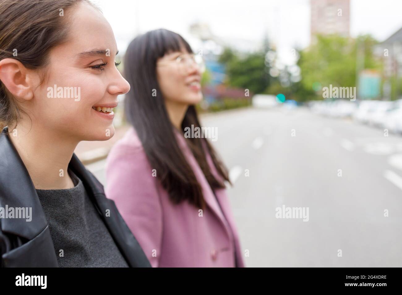 Smiling colleagues leaving together after work Stock Photo - Alamy