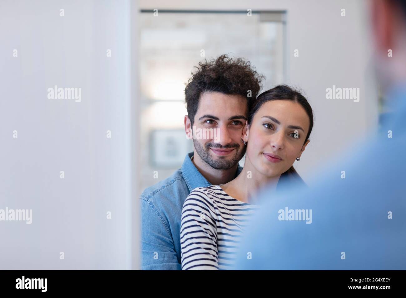 Young man standing in front of mirror hi-res stock photography and ...