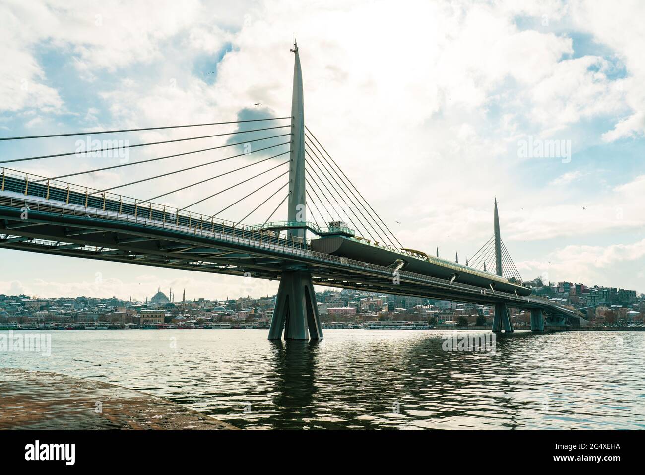 Turkey, Istanbul, Sun shining over Golden Horn Metro Bridge Stock Photo ...