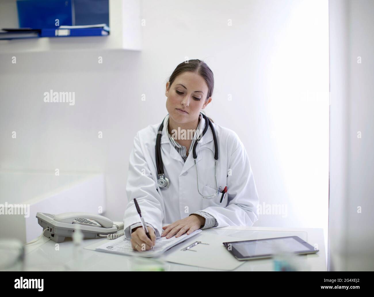 Sitting writing document table hi-res stock photography and images - Alamy