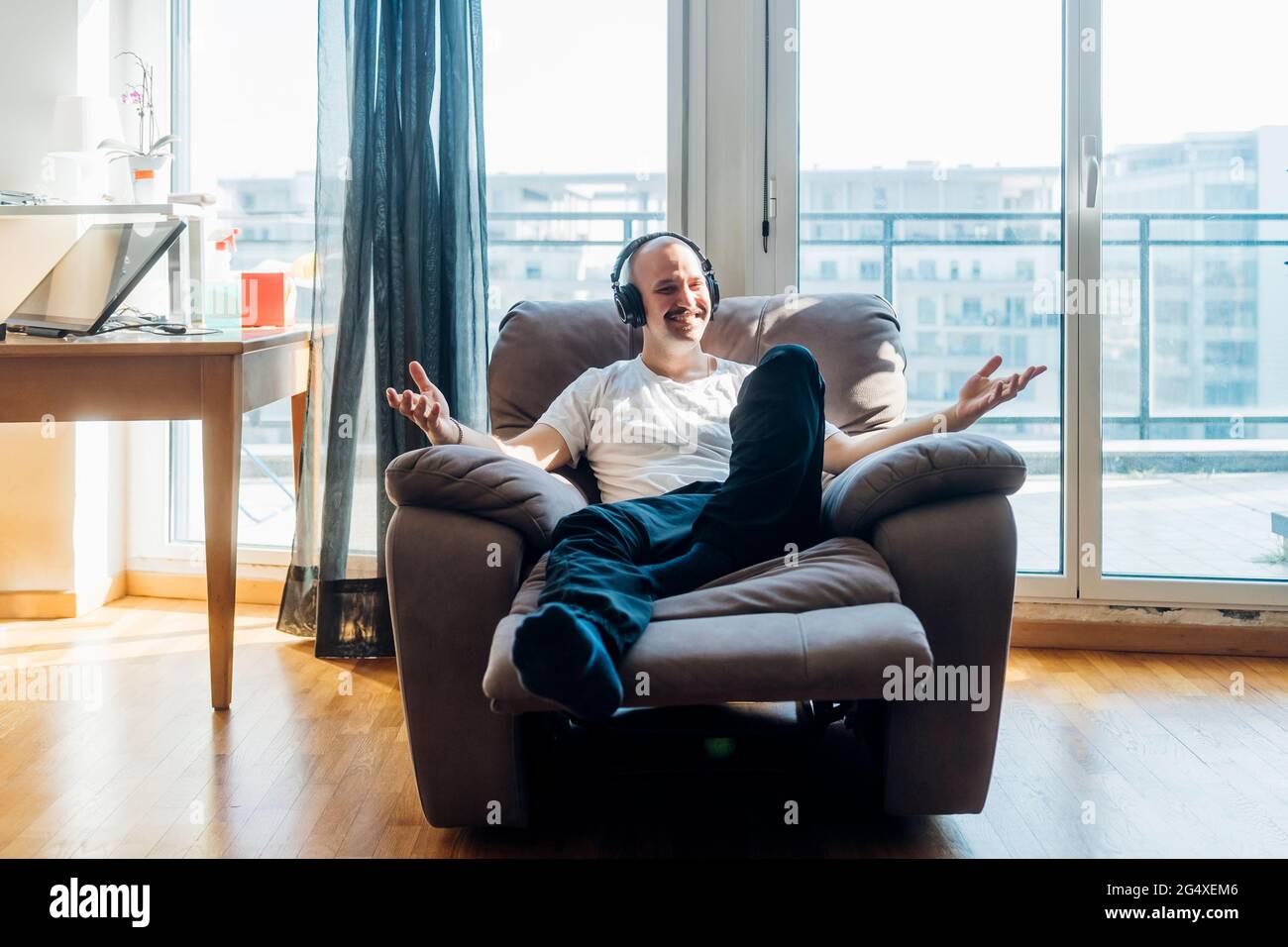 Man reclining in living room hi-res stock photography and images - Alamy