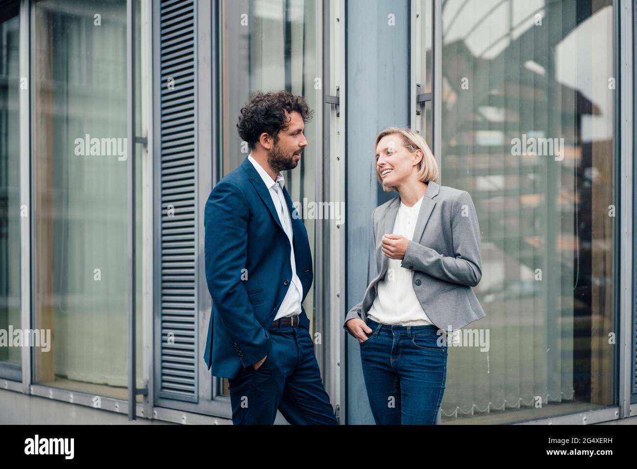 Two business partners discussing building hi-res stock photography and ...