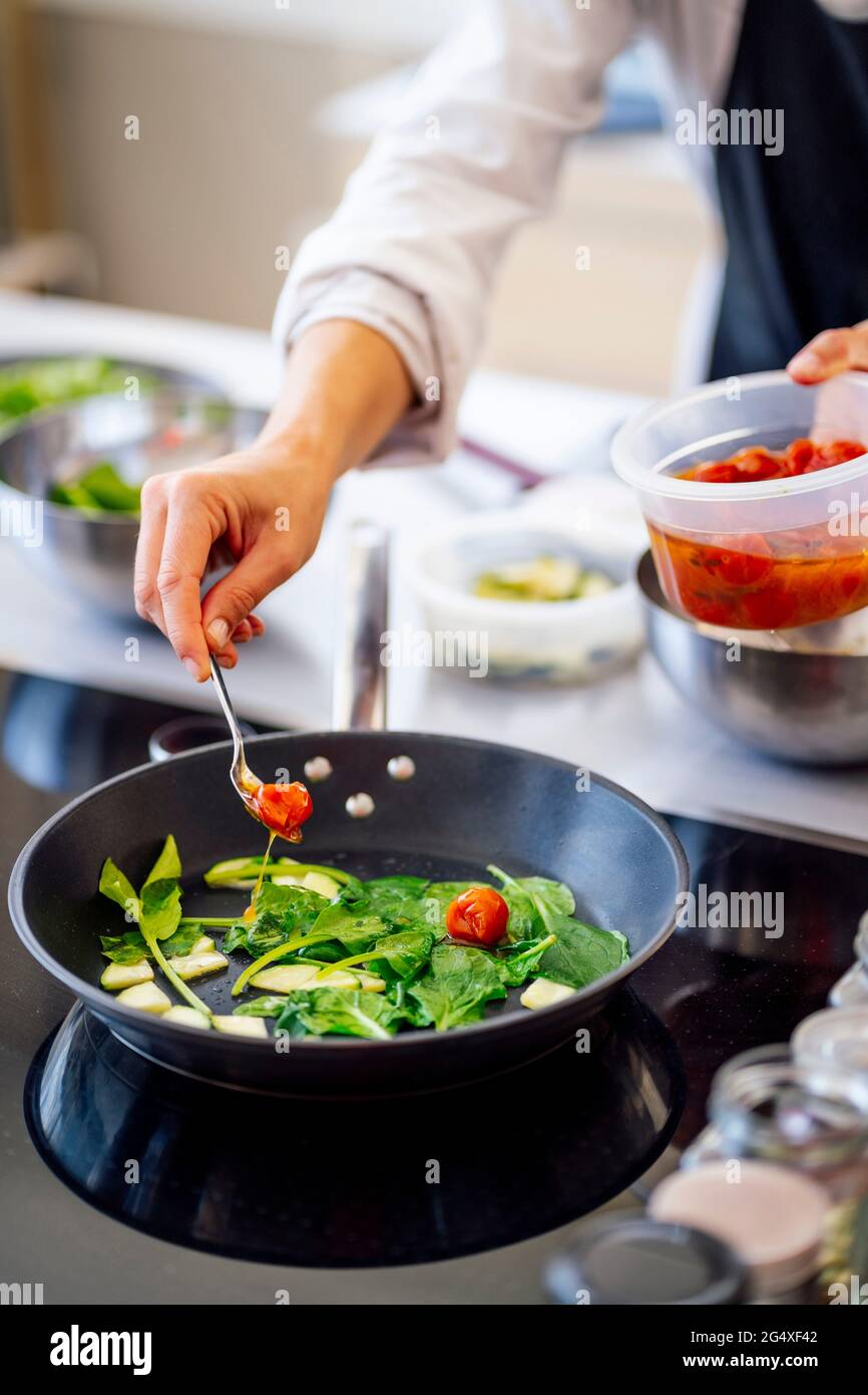 Person preparing vegetables in modern hi-res stock photography and ...
