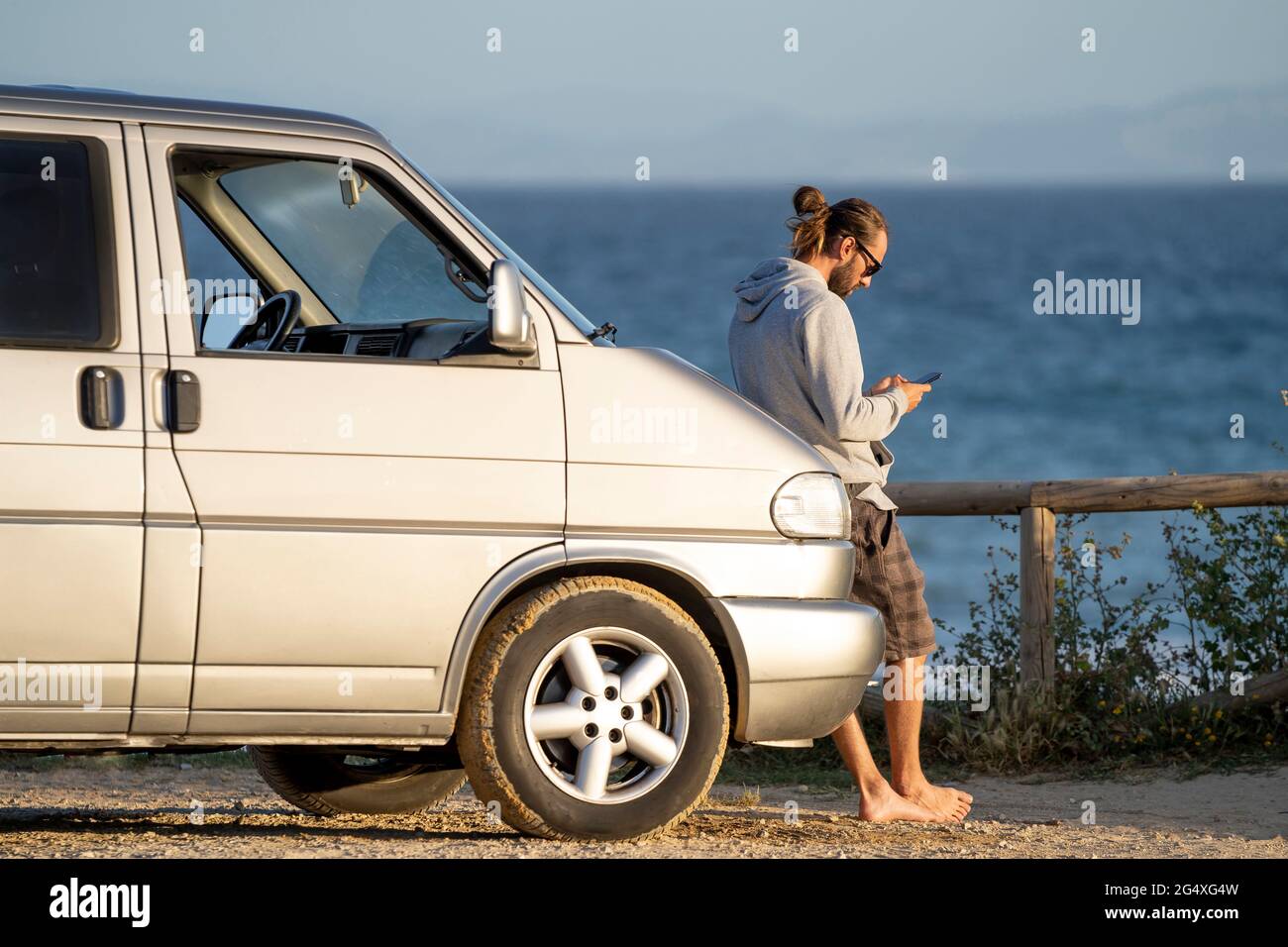 Man at minivan at sunset hi-res stock photography and images - Alamy
