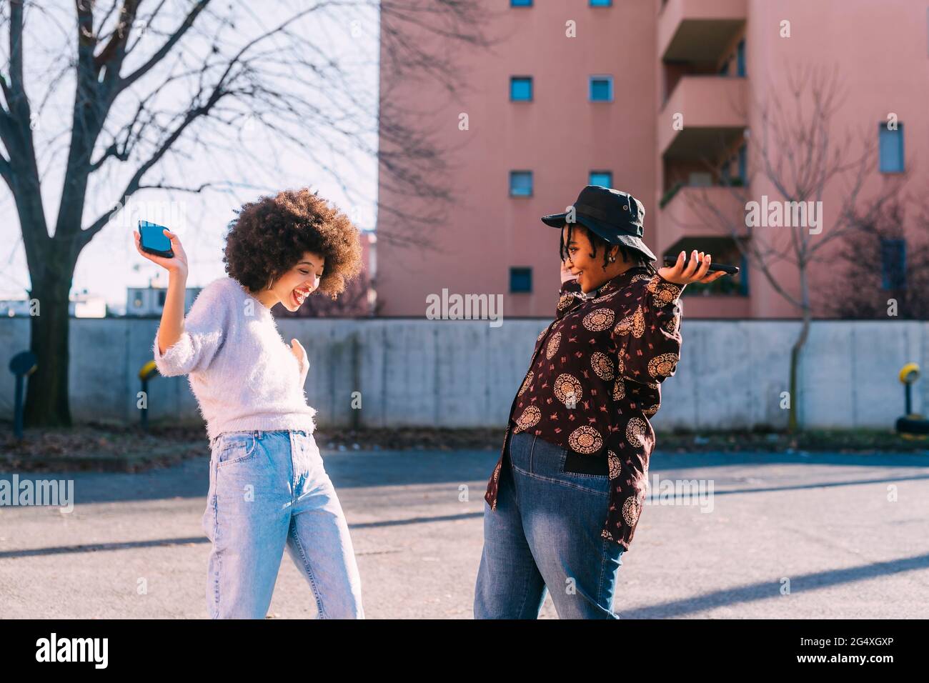 Young woman dancing with joy on road hi-res stock photography and ...