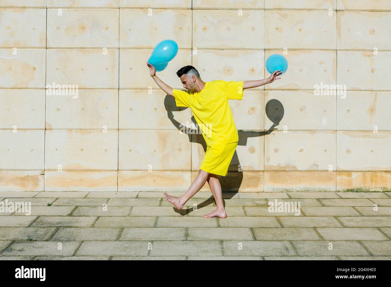 Standing man with balloons hi-res stock photography and images - Alamy