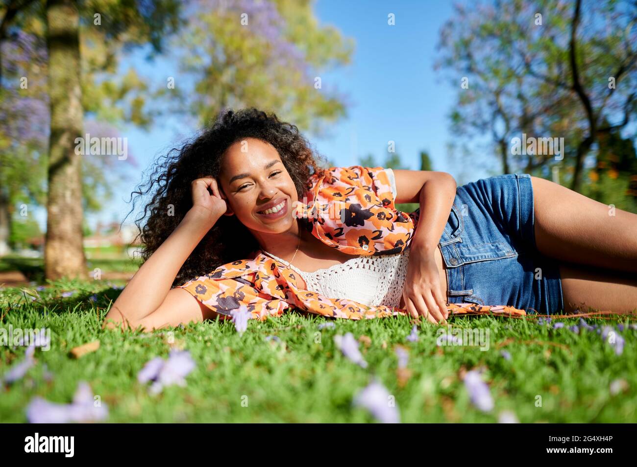 Woman lying in the sunshine hi-res stock photography and images - Alamy