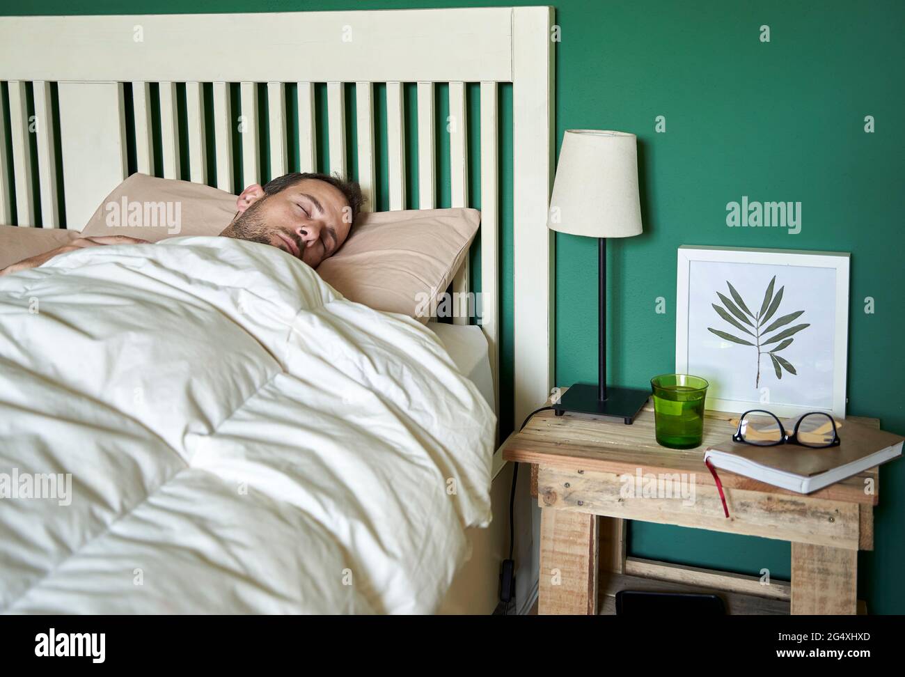 Man sleeping in bed hi-res stock photography and images - Alamy