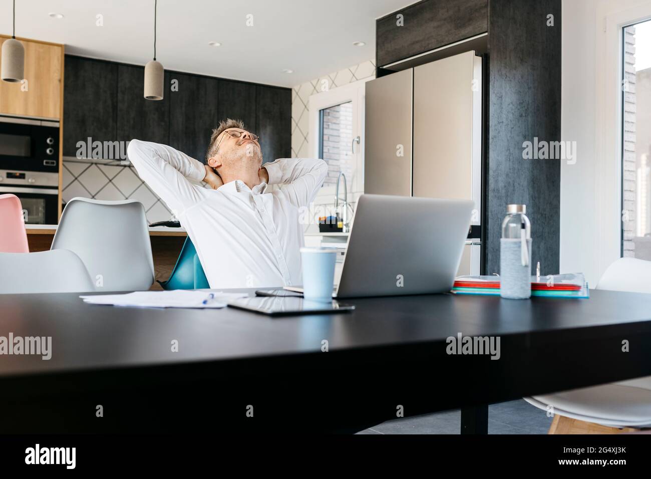 Behind table in interior hi-res stock photography and images - Alamy