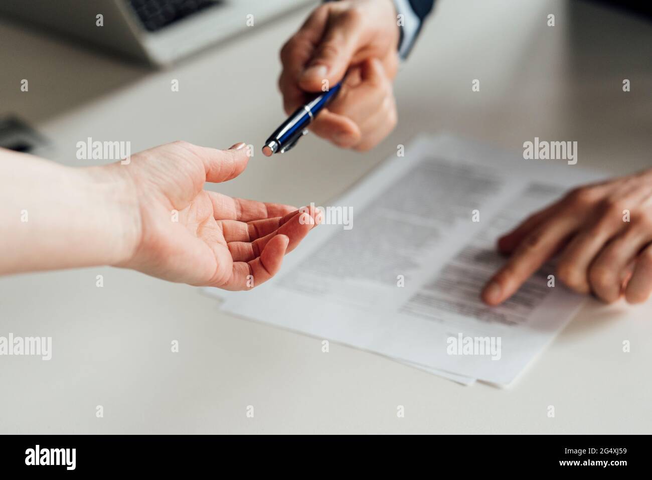 Selective focus woman giving contract hi-res stock photography and ...