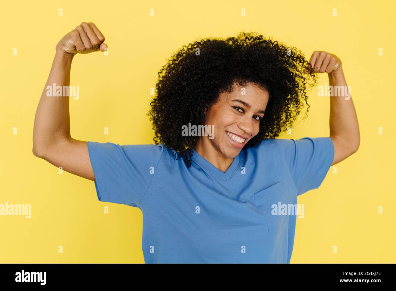 Woman flexing muscles hi-res stock photography and images - Alamy