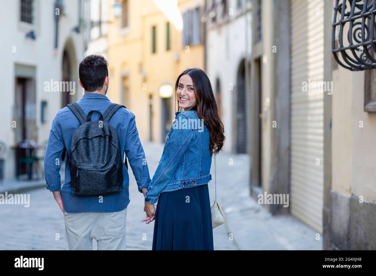 Woman looking over shoulder at man hi-res stock photography and images ...