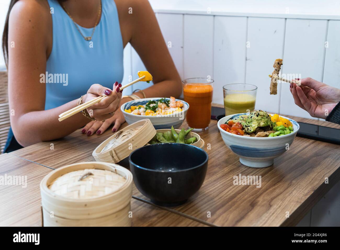 Two female chinese caucasian hi-res stock photography and images - Alamy