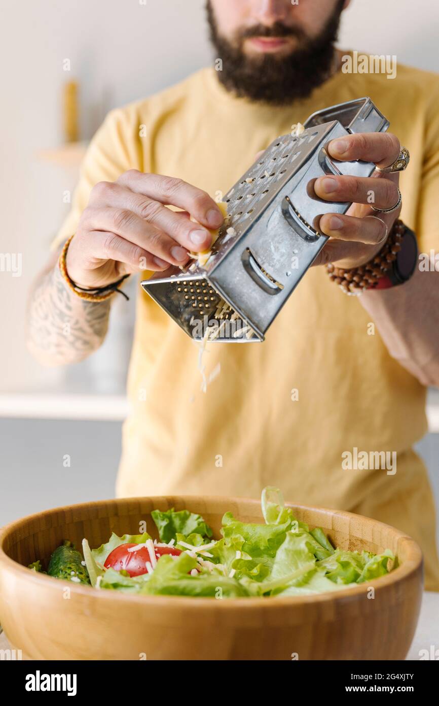 Grating cheese hi-res stock photography and images - Alamy