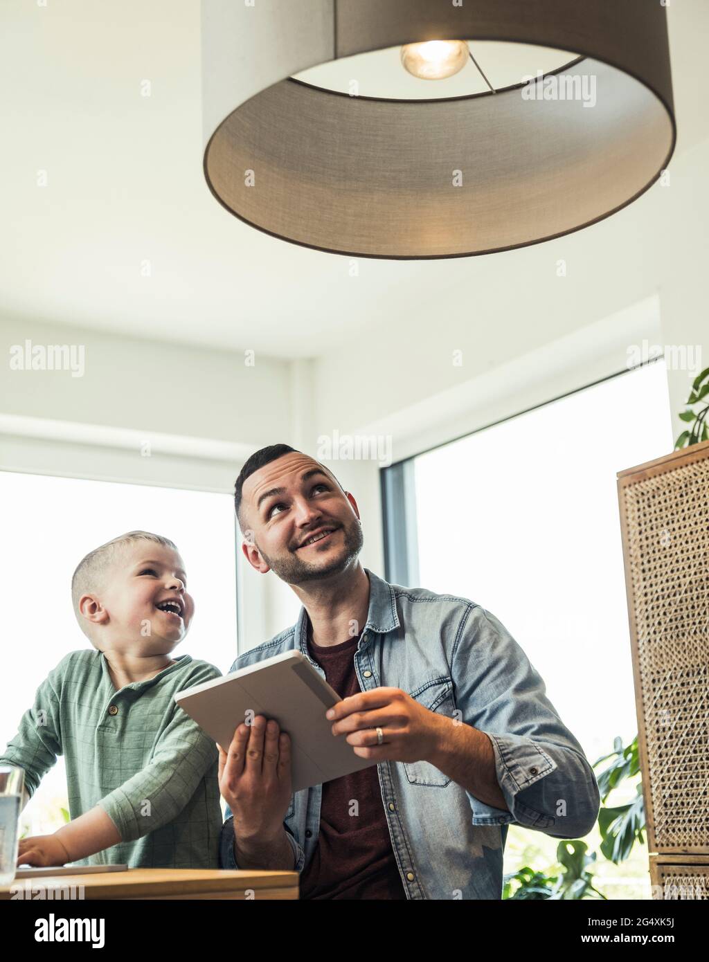Man turning off smart lamp hi-res stock photography and images - Alamy