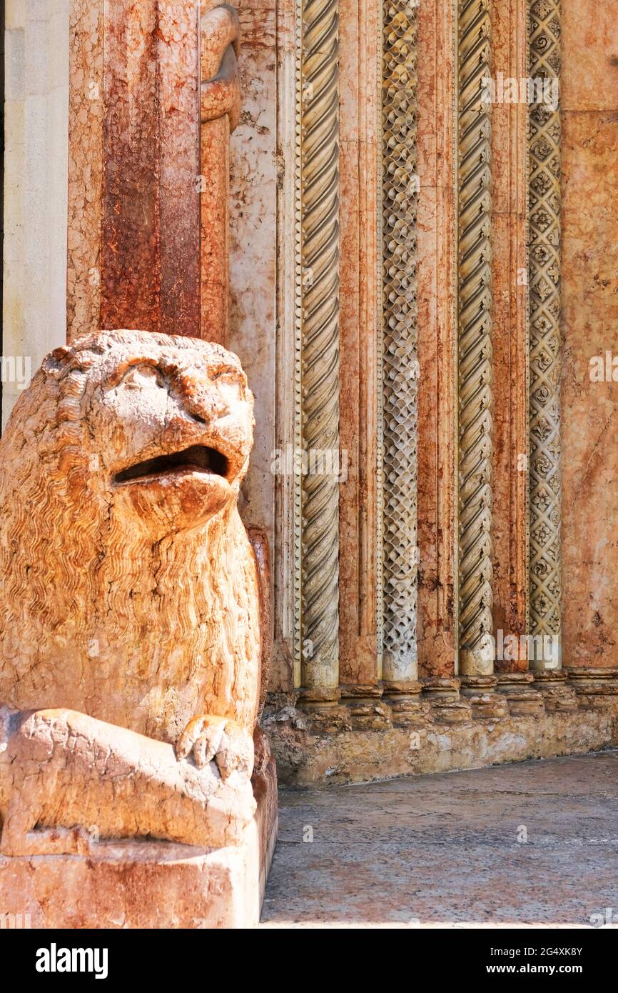 Ornate pink marble at the Porta Regia entrance of the Duomo in Modena ...