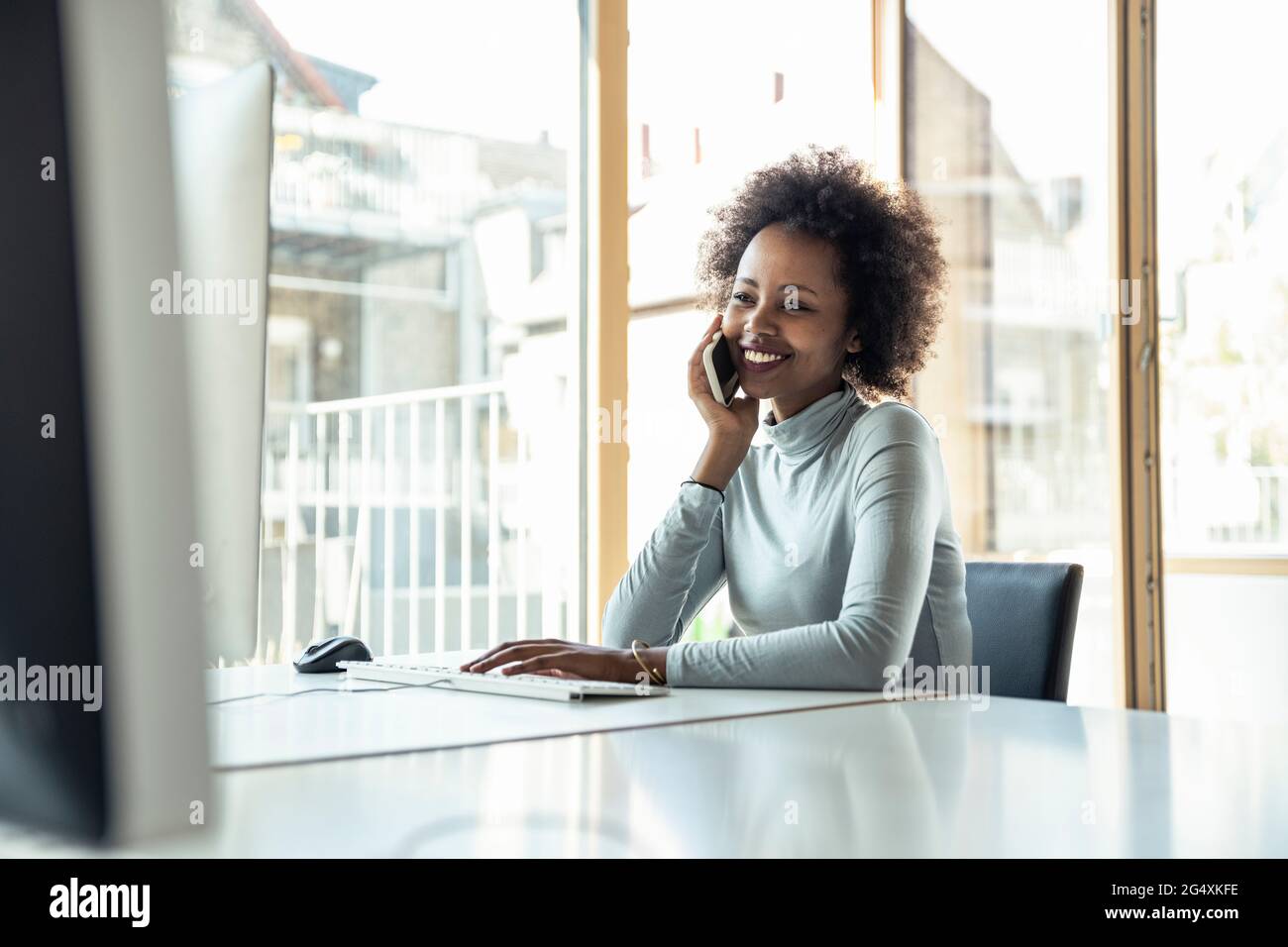 Female employee talking on hi-res stock photography and images - Alamy