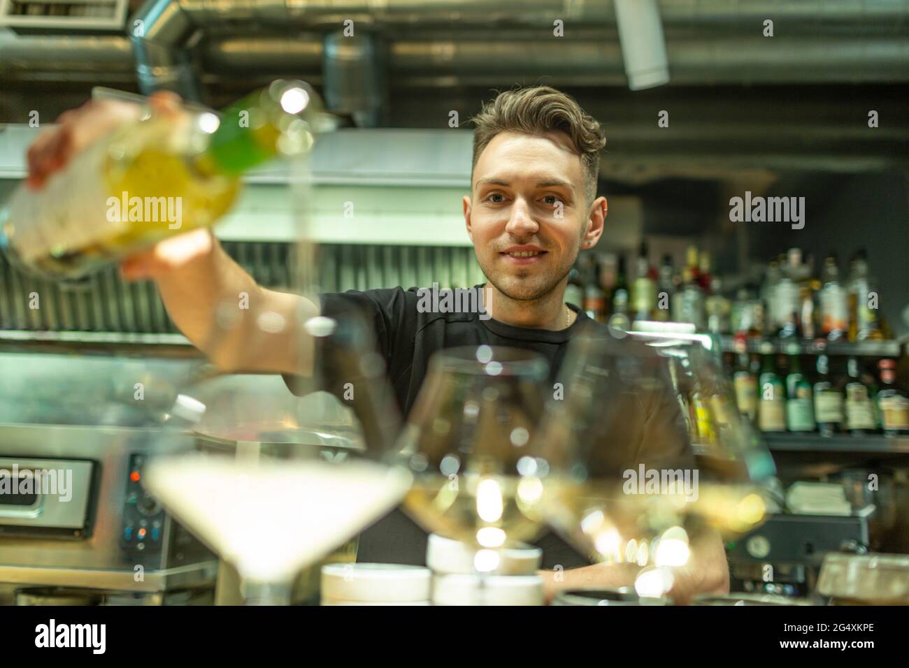 Working at bar hi-res stock photography and images - Alamy
