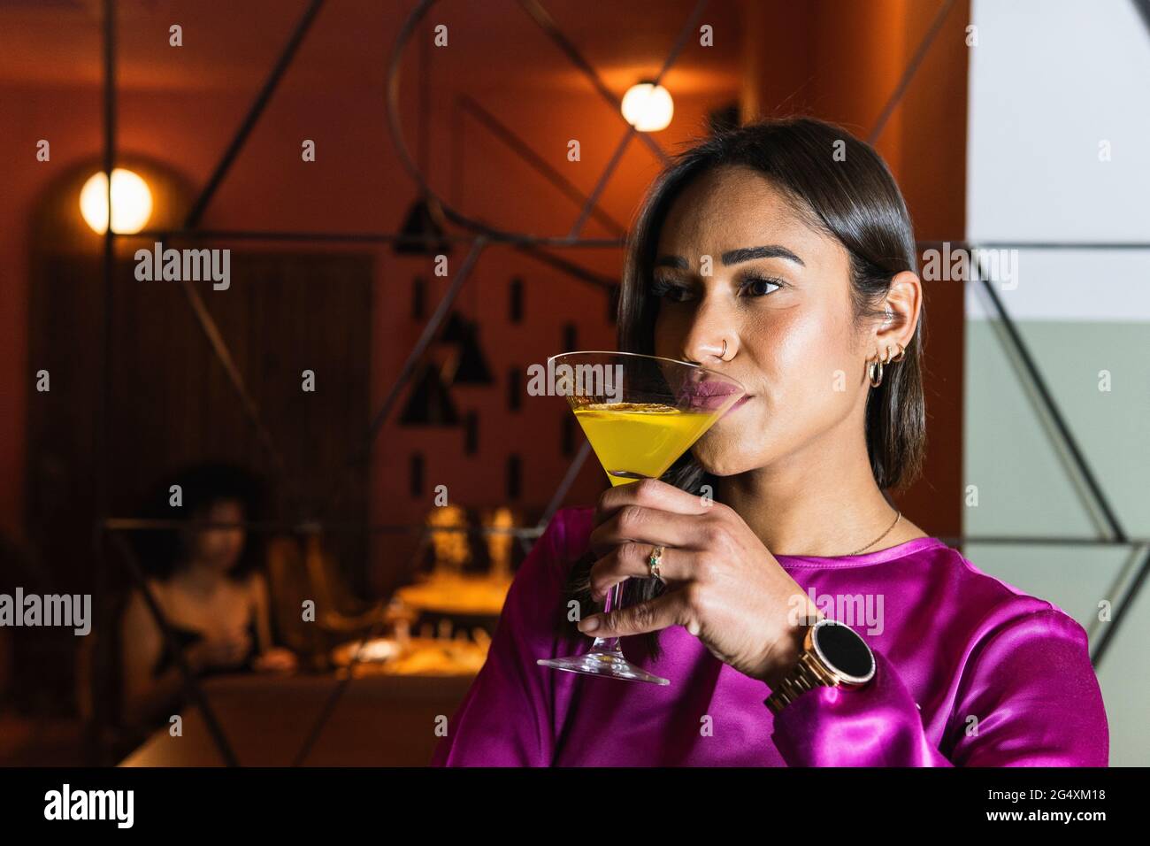 Young woman with cocktail glass hi-res stock photography and images - Alamy