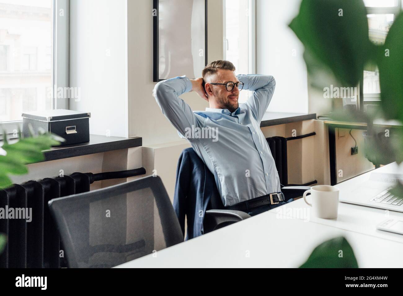 Man sitting behind desk front view hi-res stock photography and images ...