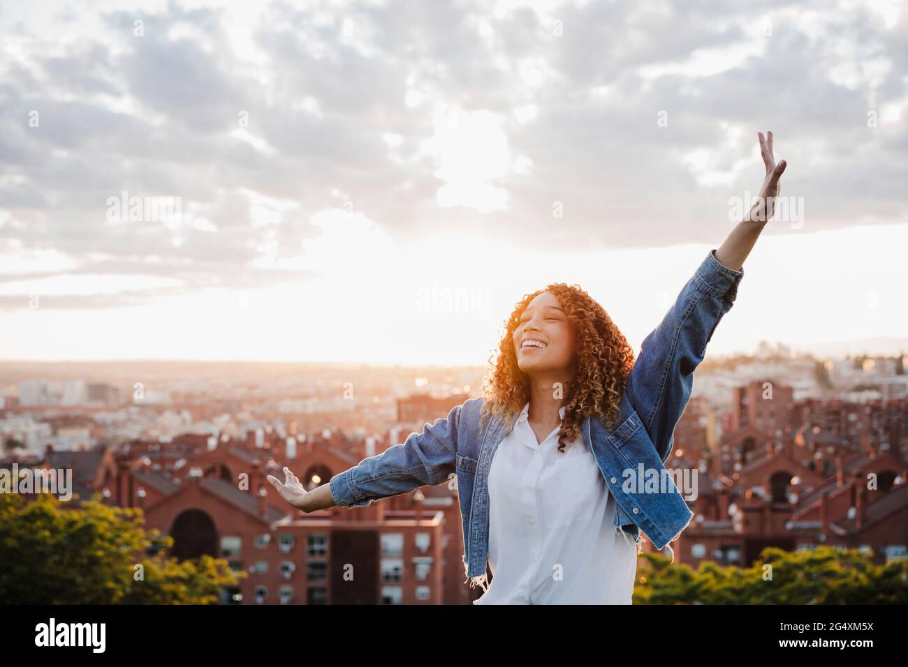 Woman with arms up in front of her hi-res stock photography and images ...