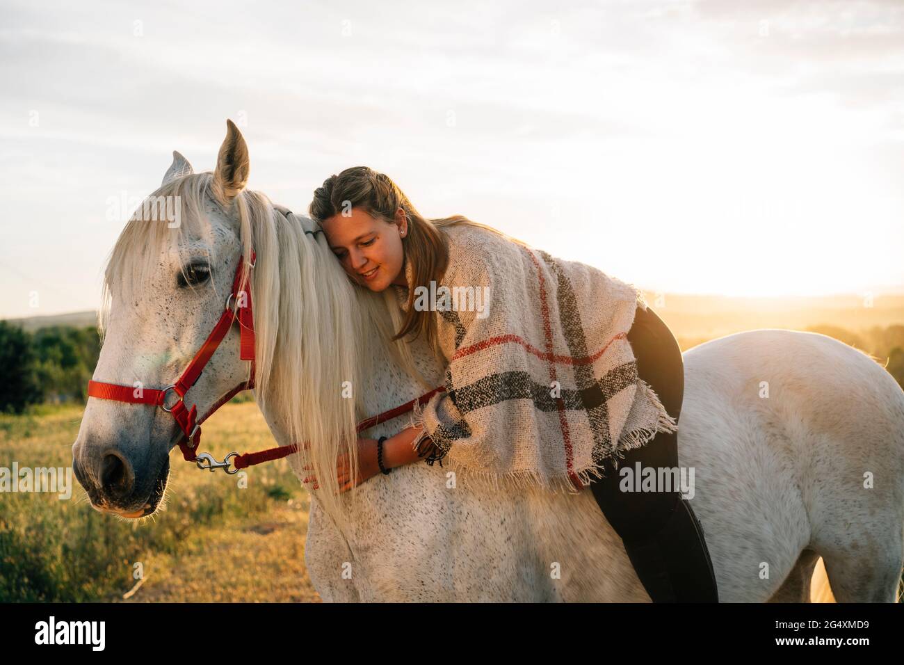 Young woman riding white horse hi-res stock photography and images - Alamy
