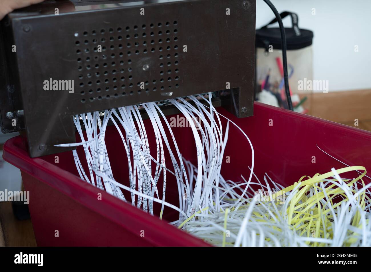 Blurry photo of shredding paper for security Stock Photo - Alamy