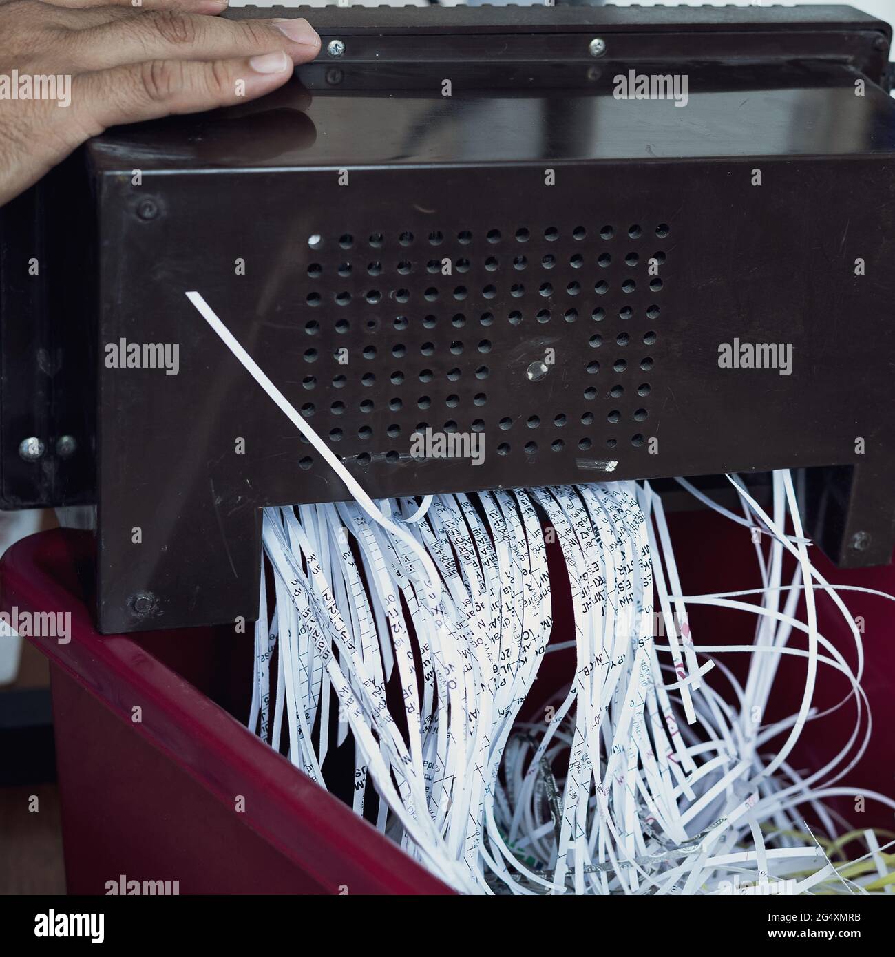 Shredding paper coming out from the machine. Top view. Shredding ...