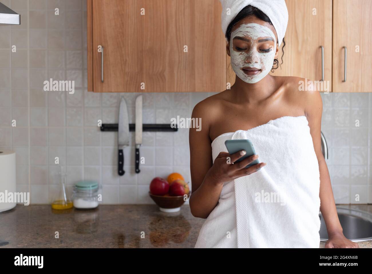 Young woman wearing towel hi-res stock photography and images - Alamy
