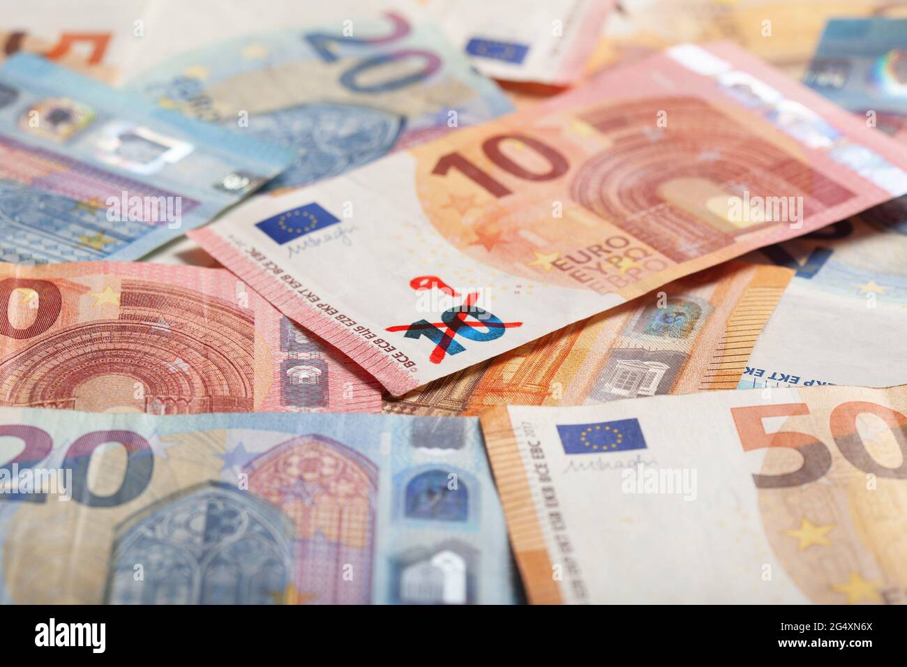 Ten euro banknote with number 9 written on it symbolizing devaluation ...