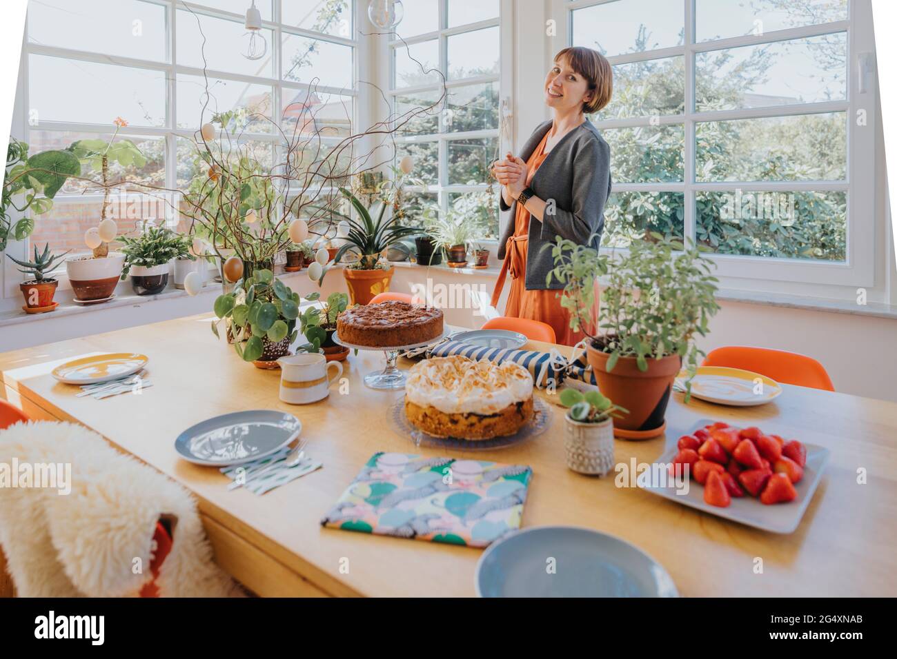 Three adults at dining table hi-res stock photography and images - Alamy