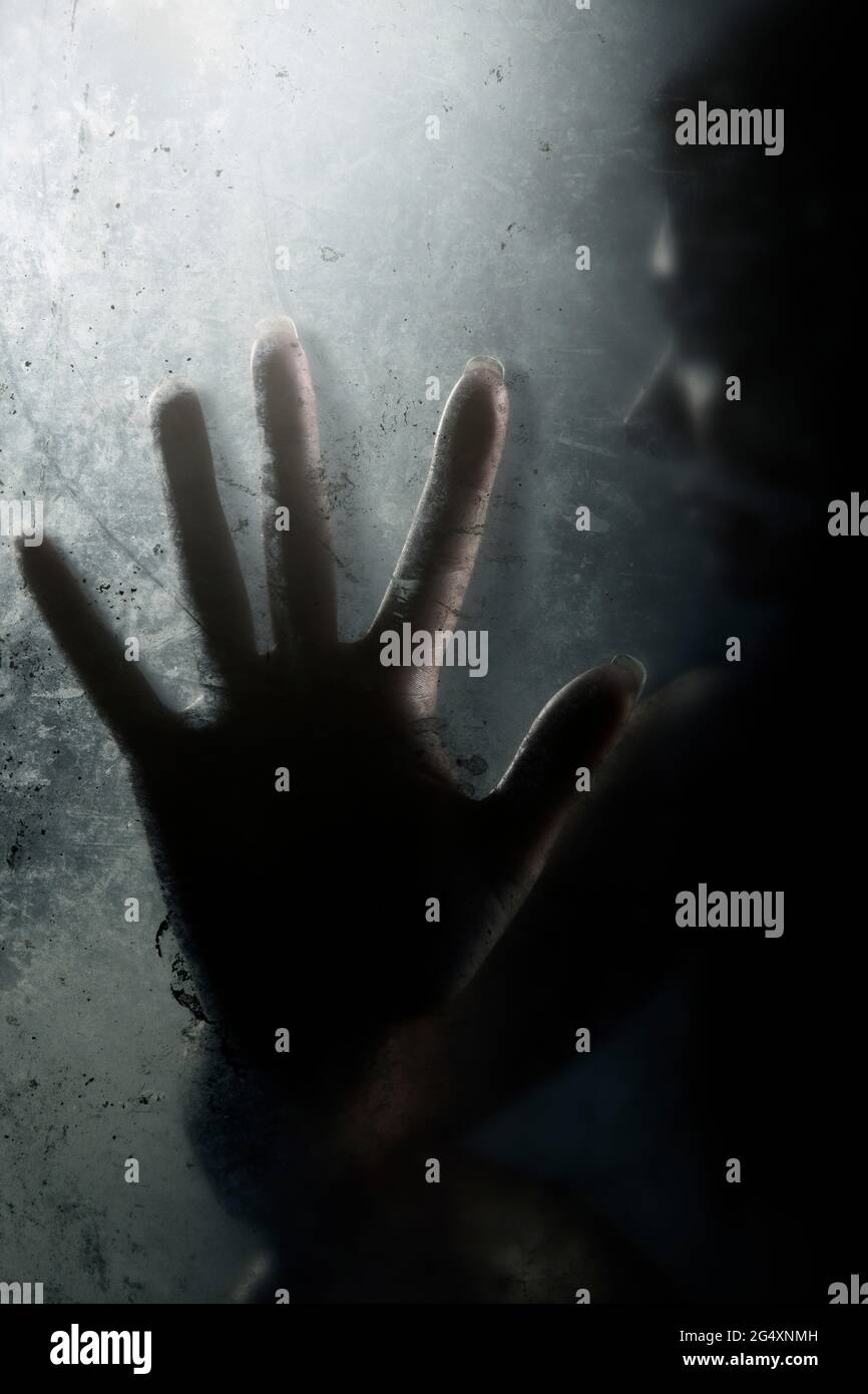 Silhouette hand on frosted glass Stock Photo - Alamy