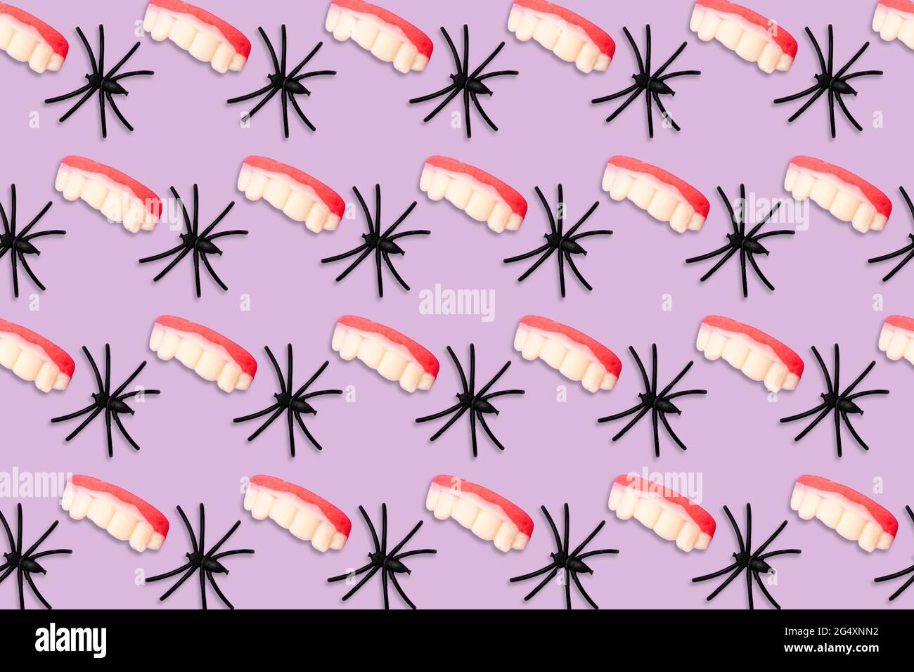 Halloween pattern of spiders and teeth candy Stock Photo - Alamy