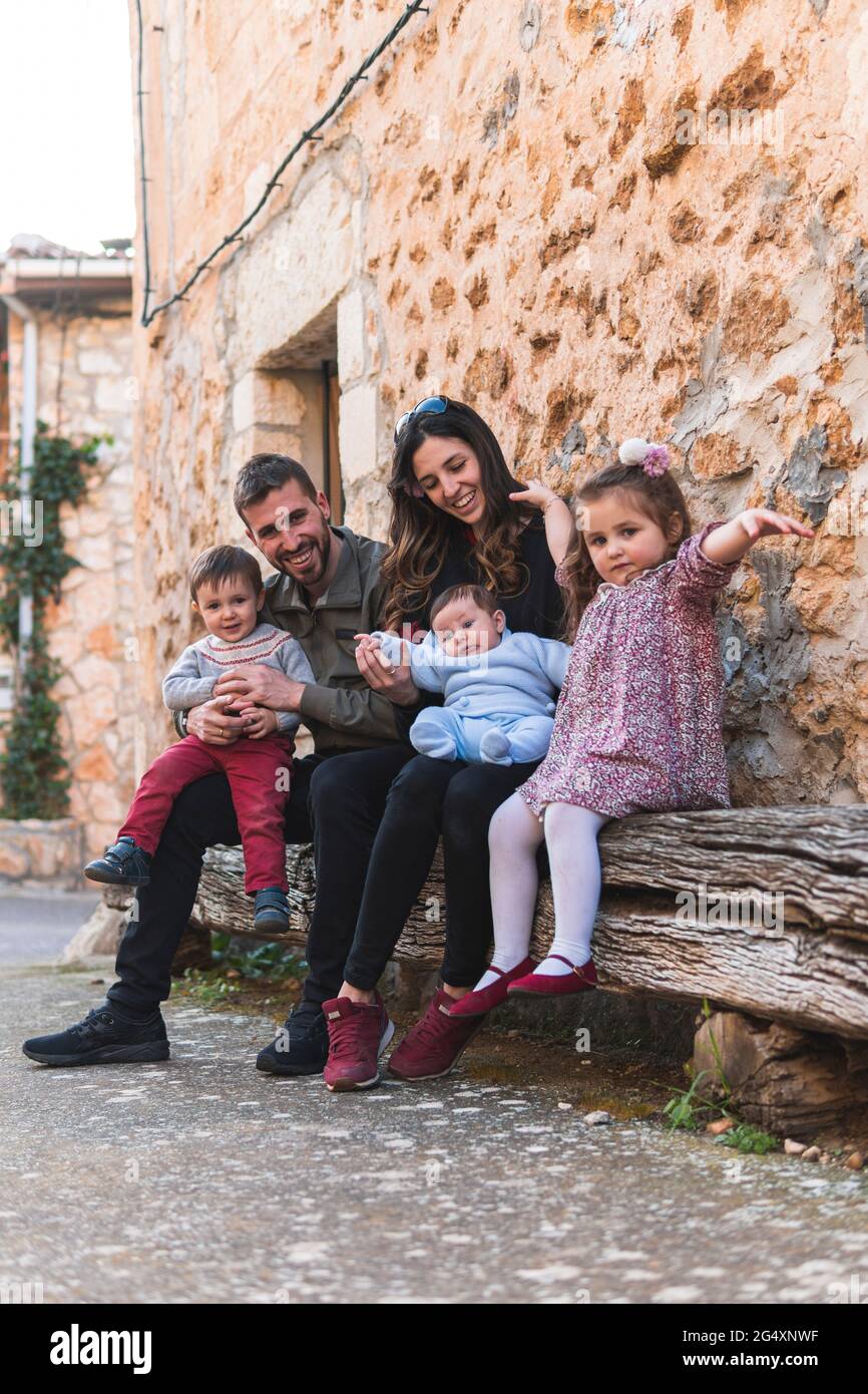Boy and girl sitting on the bench hi-res stock photography and images ...