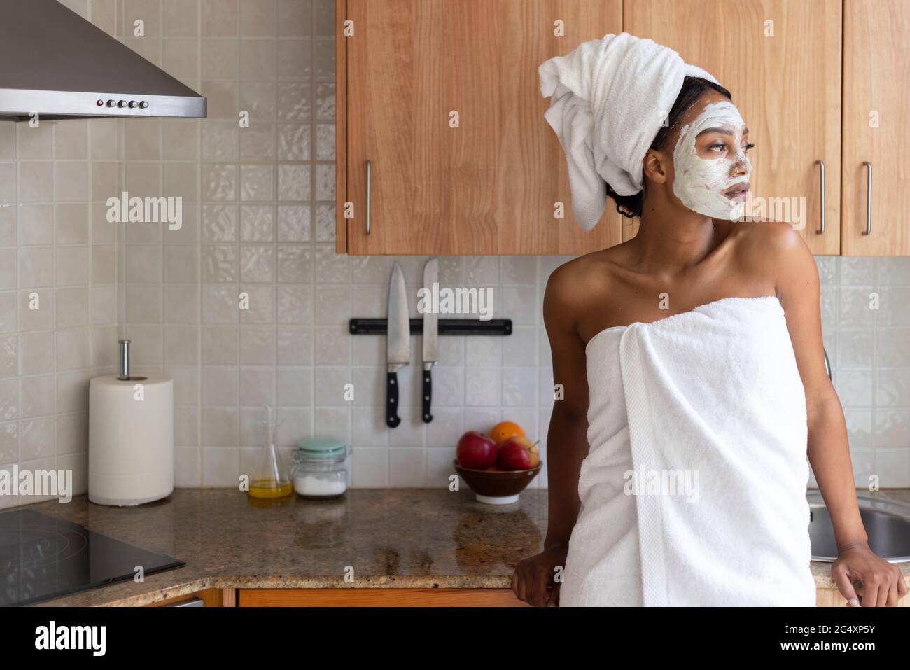 Young woman wearing towel hi-res stock photography and images - Alamy