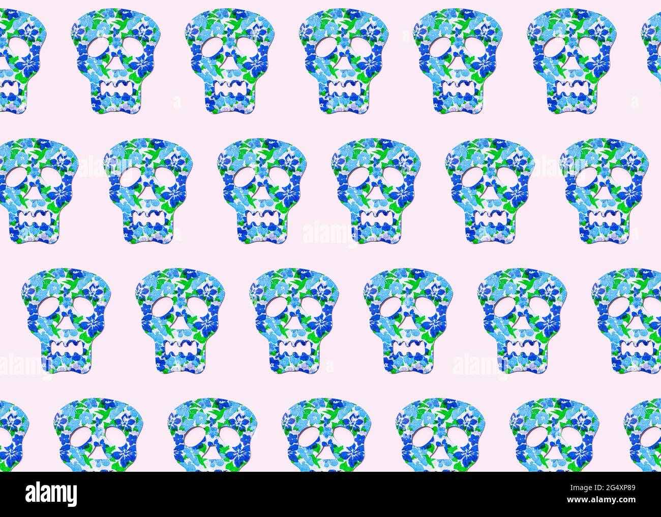 Pattern of rows of blue skull masks decorated with floral print Stock ...