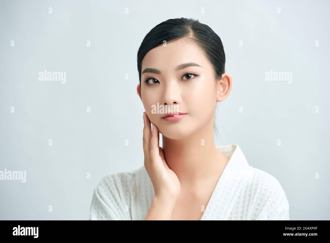 Beautiful Asian young woman touching soft cheek smile with clean fresh ...