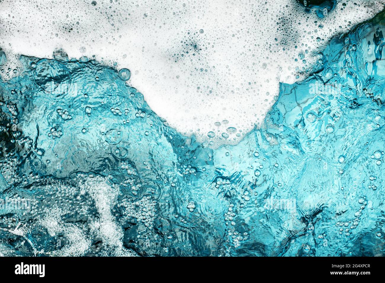 White foam clear blue water background closeup, sea ocean foam wave ...
